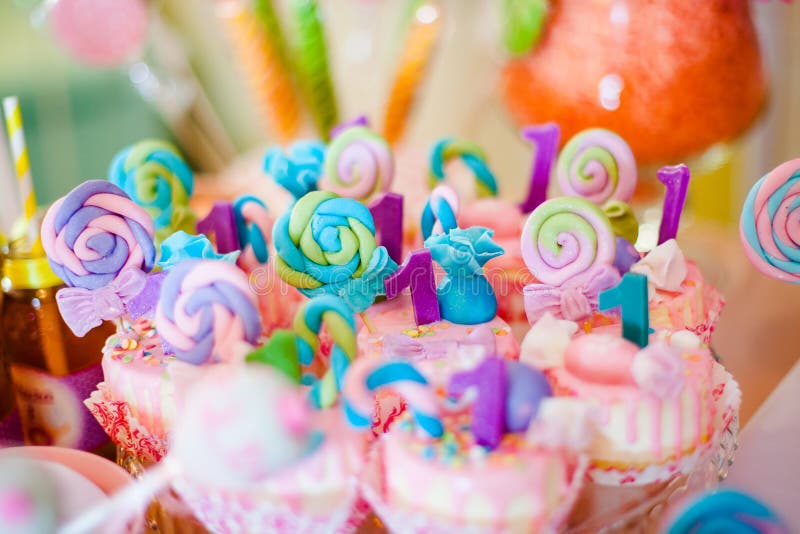 Pink and Blue Cupcakes with Colored Lollypops for Candy Bar Stock Image ...
