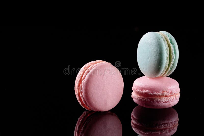Pink and Blue Macarons Isolated on Black Background Stock Image - Image ...