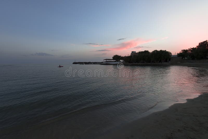 Pink and Blue Sunset on the Beach in Creta, Greece. a Beach with Blacks ...