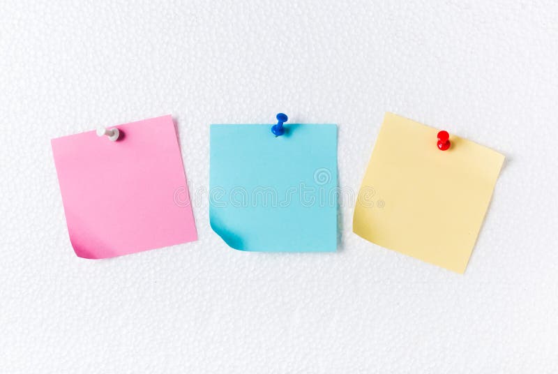 Pink Blue and Yellow Paper Note with Pin on Foam Sheet Stock Photo ...