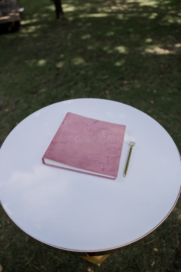 Pink Book with a Beautiful Pen on the Table Stock Image - Image of ...