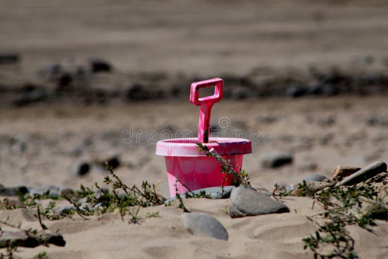 Pink Bucket and Spade on the Beach. Stock Image - Image of holiday ...
