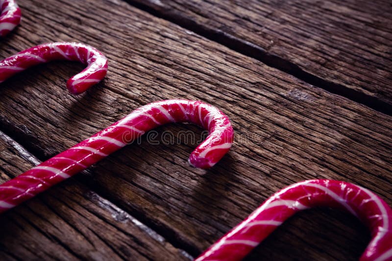 Pink Candy Canes Arranged on Wooden Plank Stock Photo - Image of ...