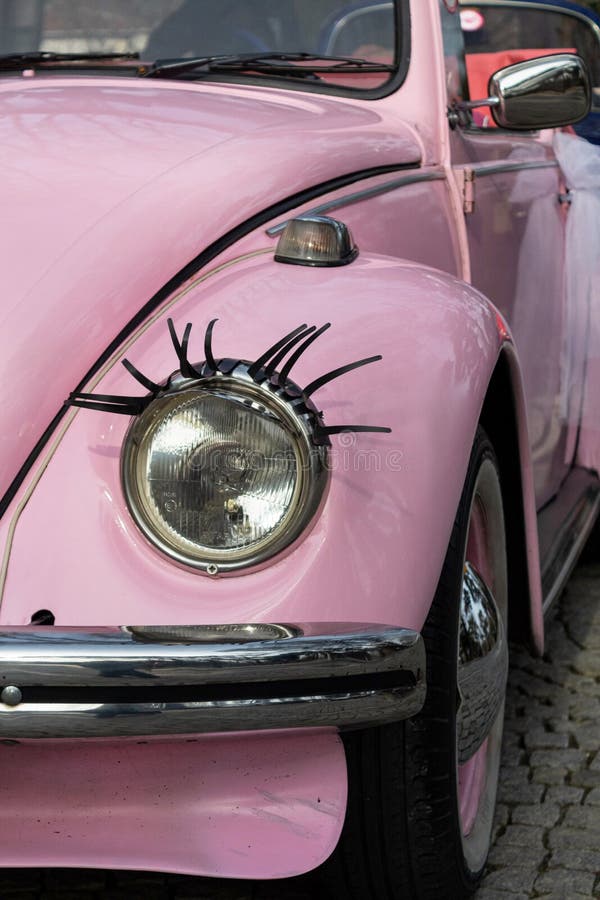 Pink Classic Car and Sticky Eyelashes in the Headlight Stock Photo ...