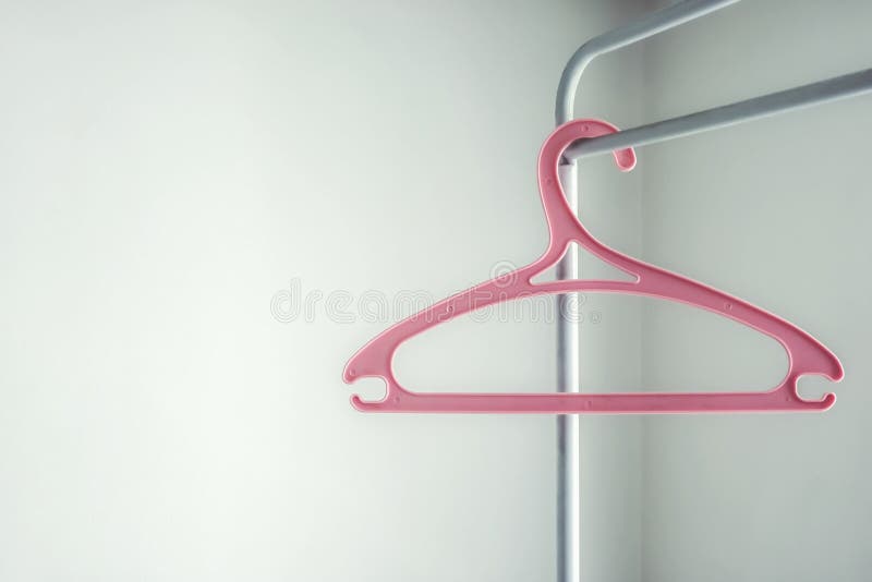 Pink clothes hanger stock photo. Image of house, hang - 354105556