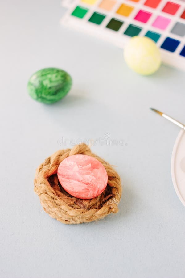 Pink Color Egg on Bright Background. Nest and Easter. Stock Photo ...