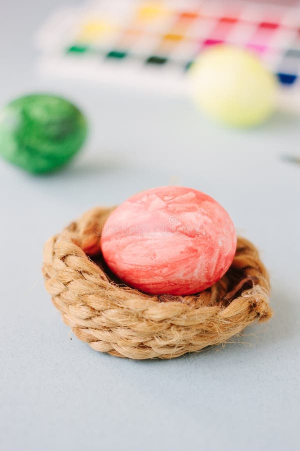 Pink Color Egg on Bright Background. Nest and Easter. Stock Photo ...