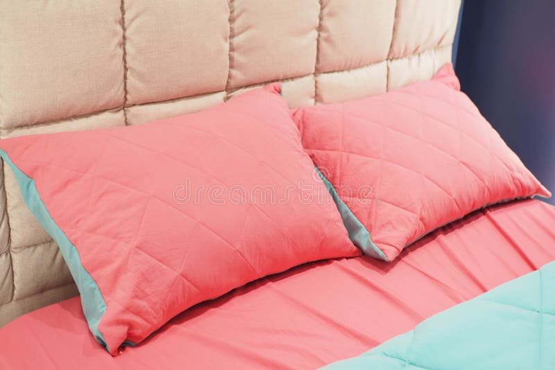 Pink Color Pillow Lined Up on Bed Stock Image - Image of pile, clean ...