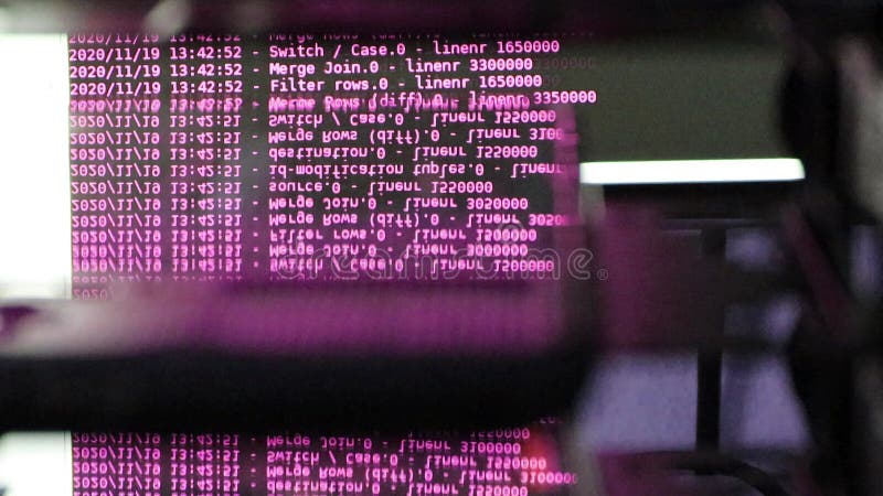 Pink Computer Software Code Moving On A Black Monitor Reflect On Glass Abstract Computer