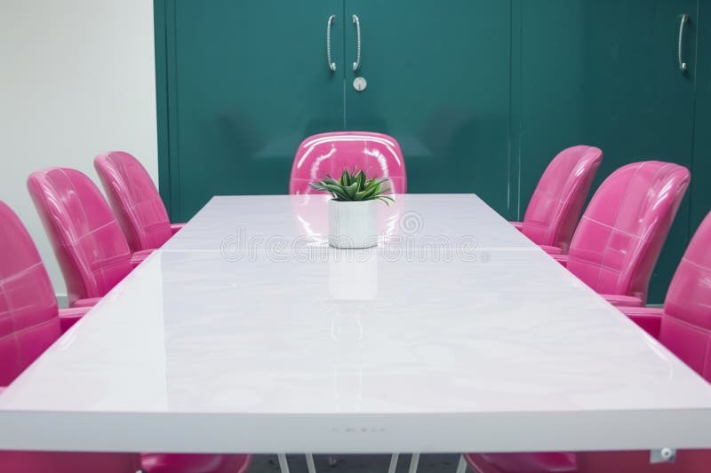 Pink Conference Chairs Around a White Meeting Table, Nobody Present ...