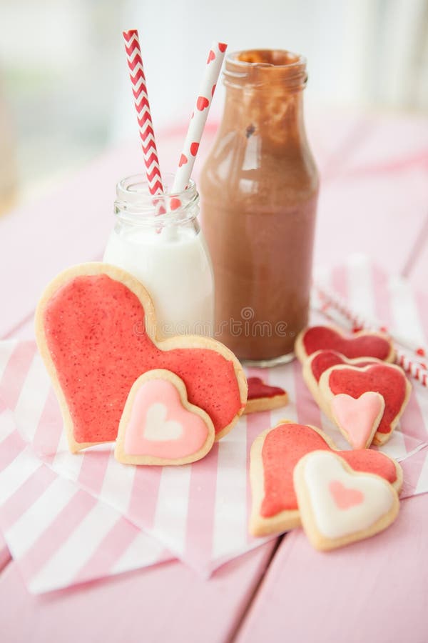 Pink cookies and milk stock photo. Image of coated, pink - 66035046