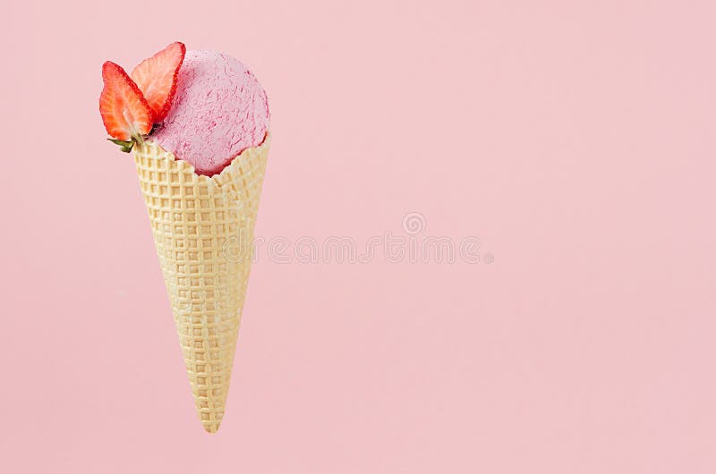 Pink Creamy Ice Cream in Crisp Waffle Cone with Strawberry Slices on ... Pink Creamy Ice Cream in Crisp Waffle Cone with Strawberry Slices on ...