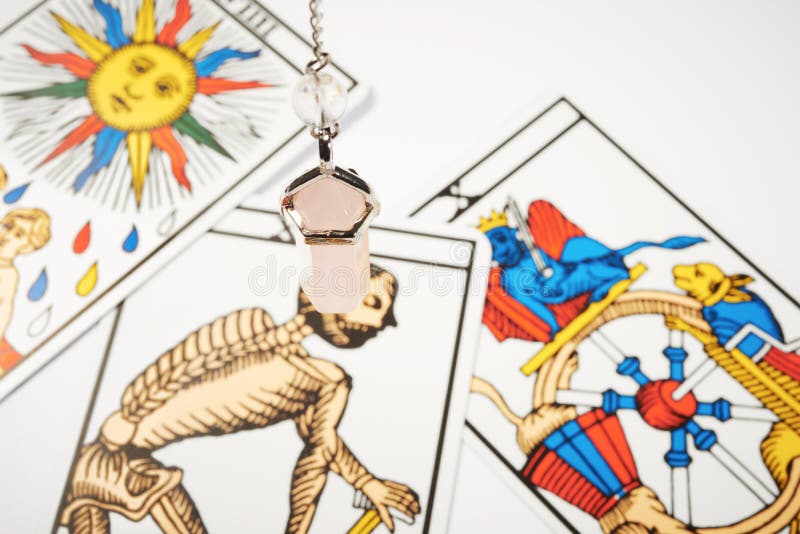 Pink Crystal Pendulum with Tarot Cards Stock Photo - Image of psychic ...