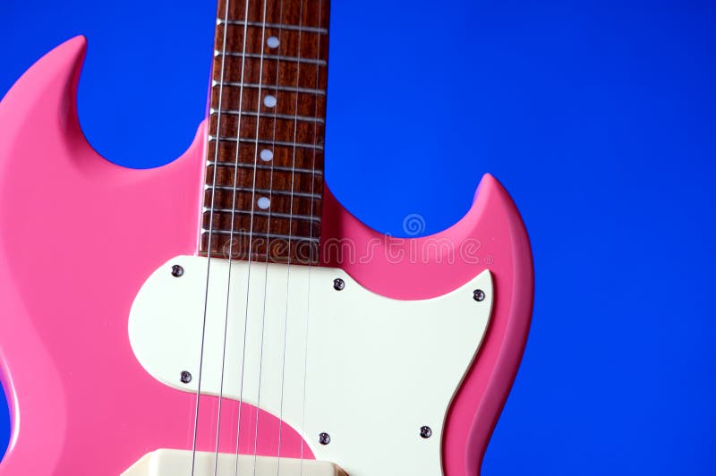 Pink Electric Guitar Isolated on Blue Stock Image - Image of guitar ...