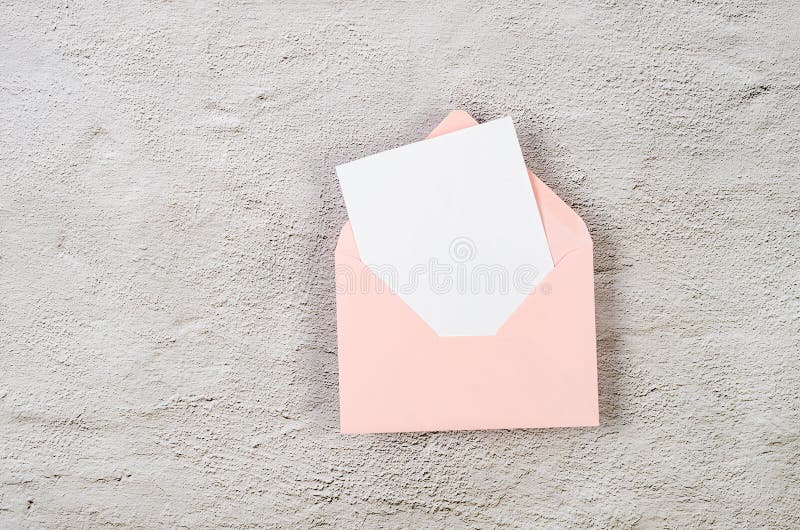 Pink Envelope with Empty White Card for Text on Grey Concrete ...