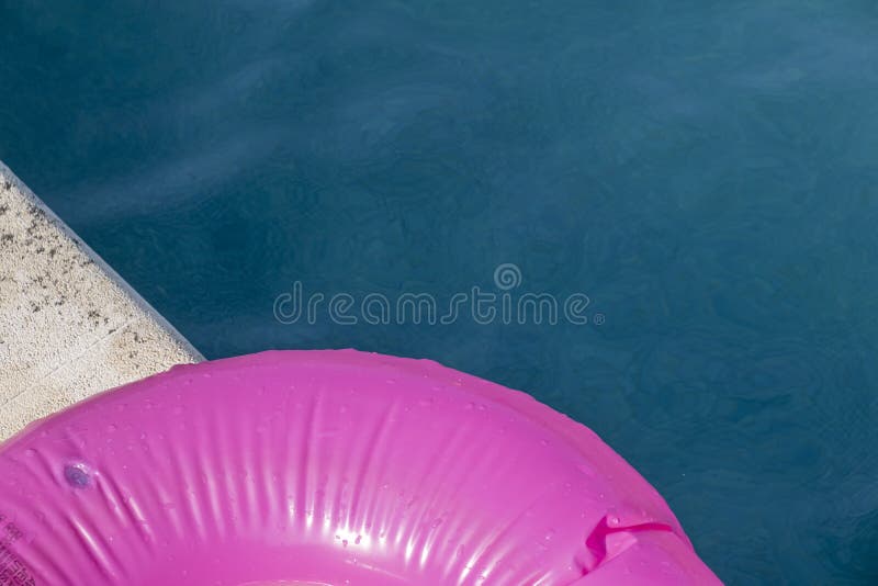 Pink Float on the Edge of a Swimming Pool Stock Image - Image of ...