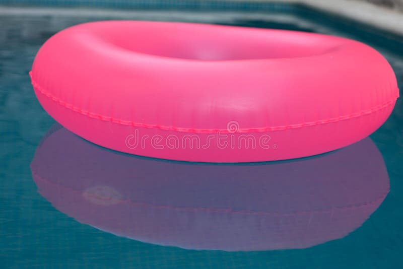 Pink float on a pool stock image. Image of float, inflatable - 96315641