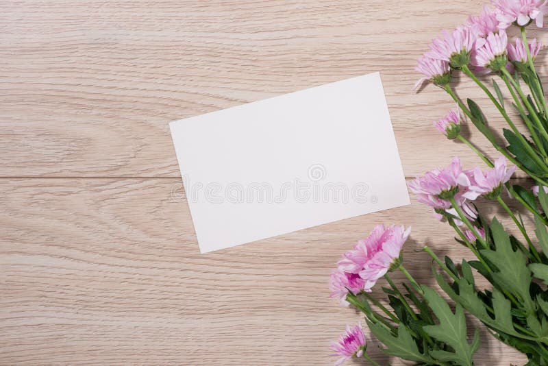 Pink Flowers and Empty Paper for Your Text on Wooden Background Stock ...