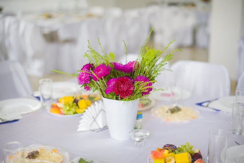 Pink flowers on the table stock image. Image of design - 46489233