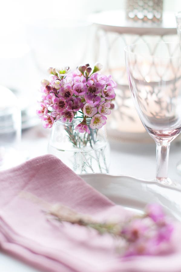 Pink flowers on a table stock photo. Image of napkin - 37996732