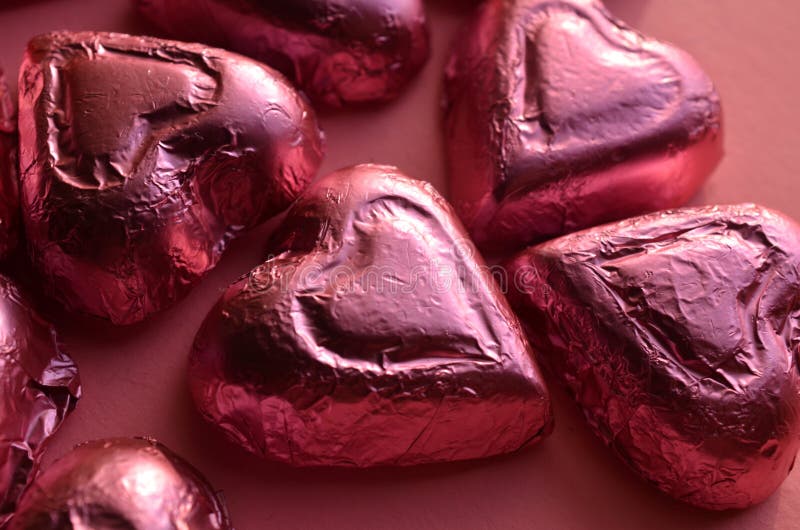 Pink Foil Wrapped Heart Shape Chocolate Pieces Stock Image - Image of ...