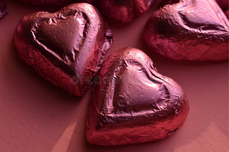 Pink Foil Wrapped Heart Shape Chocolate Pieces Stock Image - Image of ...