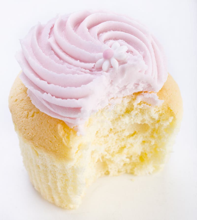Pink Frosted Cupcake with Bite Stock Image - Image of baked, frosting ...