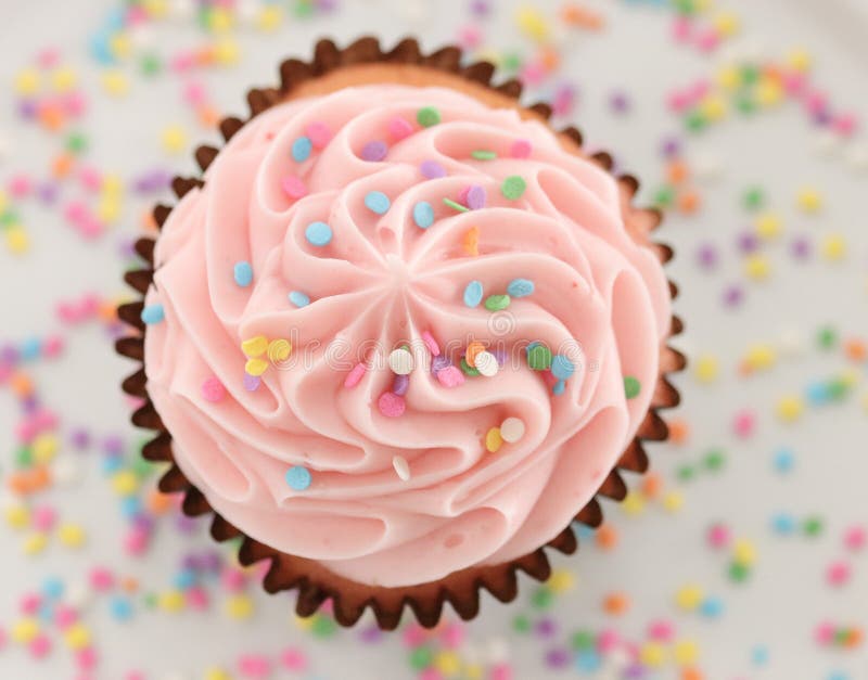 Pink frosting on a cupcake stock image. Image of pink - 163318217