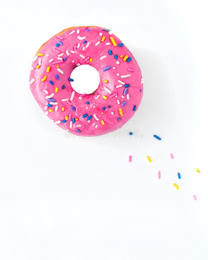 Pink Glazed Doughnut with Sprinkles on White Surface Stock Image ...