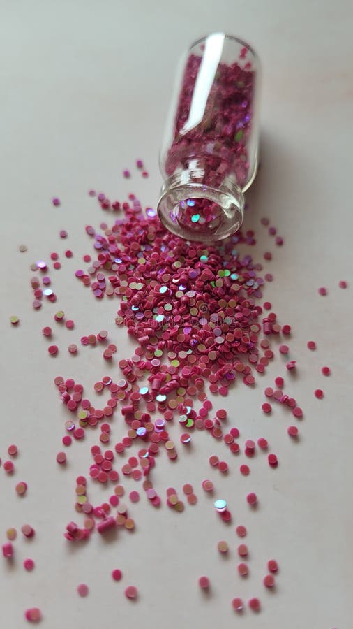 Pink Glitter Sprinkles Poured from Bottle, Isolated on White Background ...
