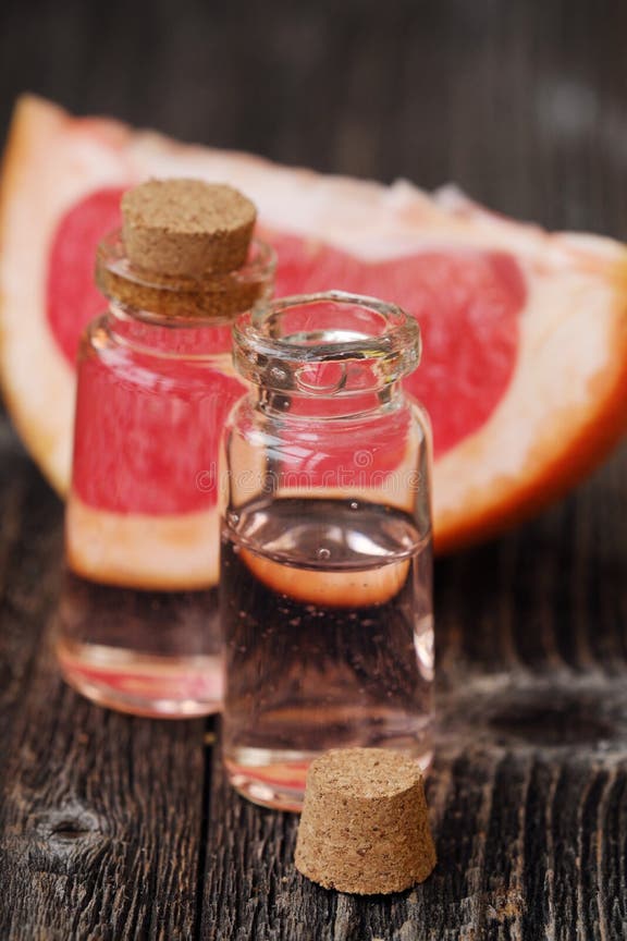 Pink Grapefruit Oil and Fruit on the Table Stock Photo - Image of view ...