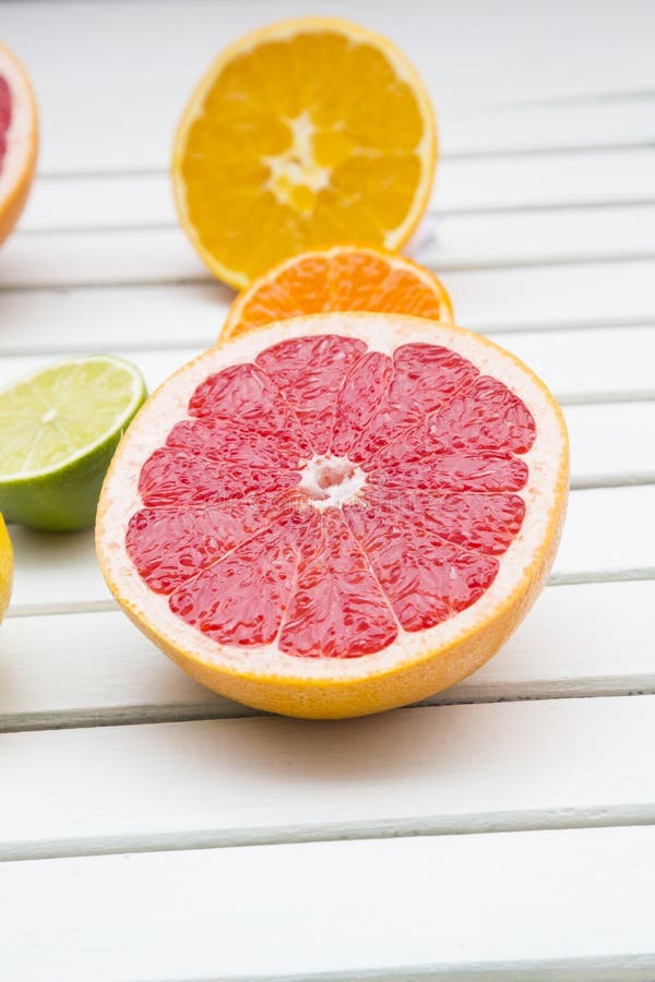 Pink Grapefruit and Tangerines on White Wood Stock Photo - Image of ...