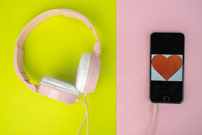 Pink Headphone Connected To the Smartphone Stock Photo - Image of music ...