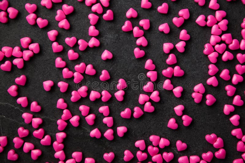 Pink Heart Sugar Sprinkles Scattered on Dark Stock Photo - Image of ...