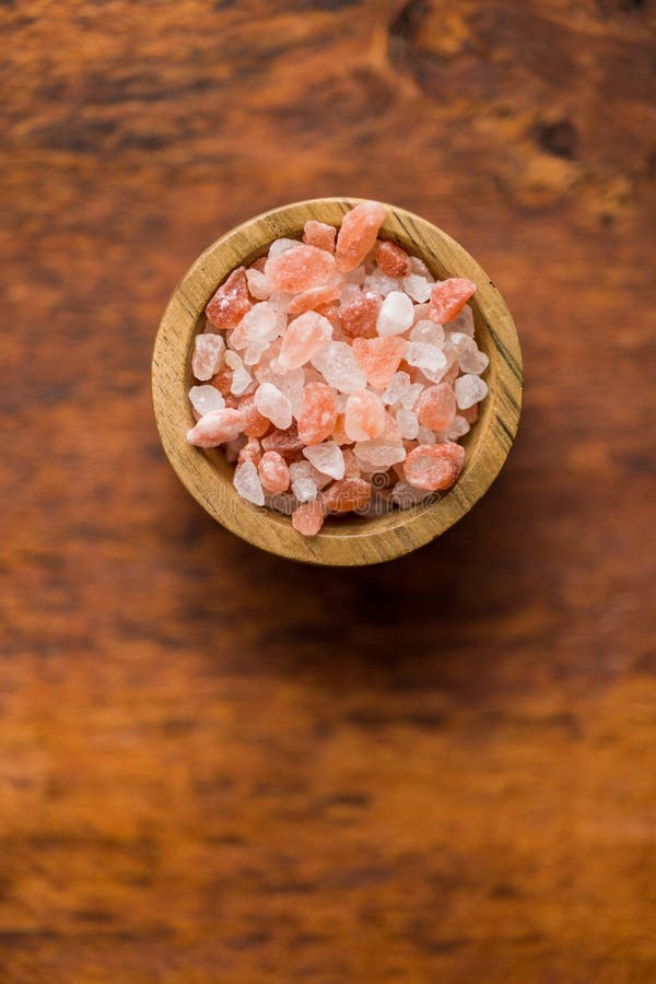 Pink Himalayan Salt in Bowl on Wooden Table. Top View Stock Photo ...