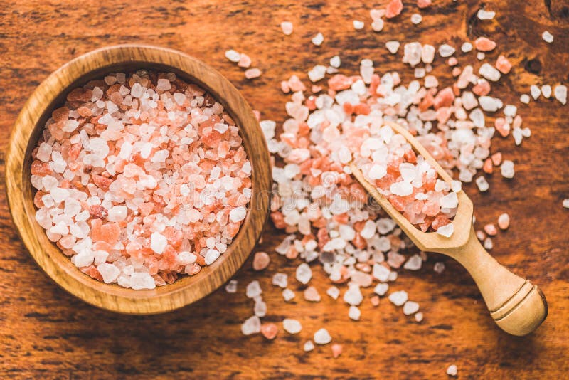Pink Himalayan Salt in Bowl on Wooden Table. Top View Stock Photo ...