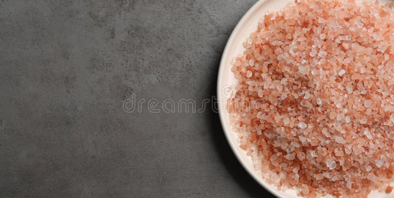 Pink Himalayan Salt on Grey Table. Space for Text Stock Photo - Image ...