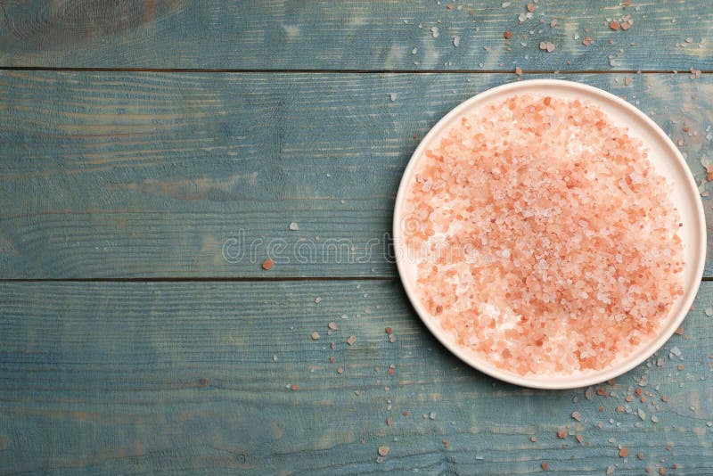 Pink Himalayan Salt on Light Blue Wooden Table, Top View. Space for ...