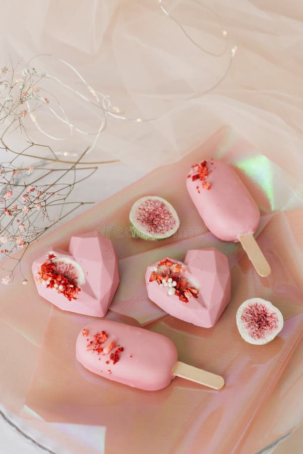 Pink Ice Cream in the Shape of a Heart and Popsicle on a Tray Stock ...