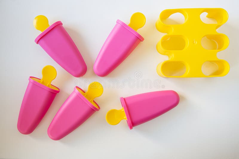 Pink Ice Cream Tins with Yellow Caps Stock Photo - Image of mold ...
