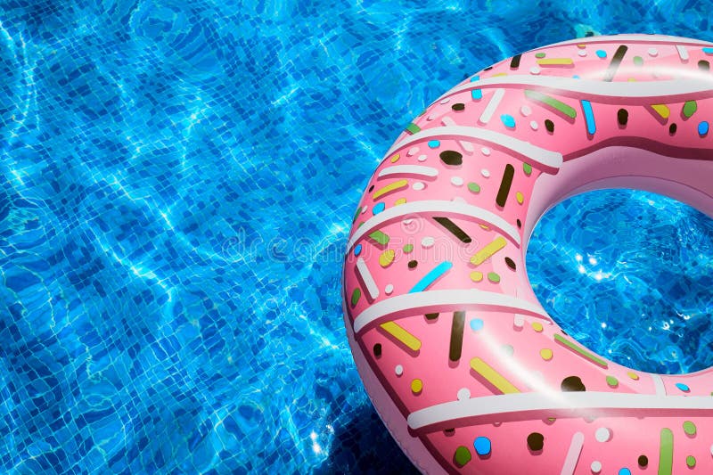 Pink Inflatable Ring in a Blue Outdoor Pool. Stock Photo - Image of ...