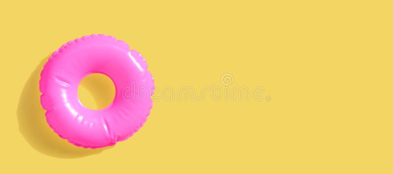Pink Inflatable Swimming Pool Ring on Yellow Stock Image - Image of ...