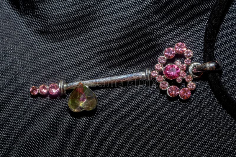 Pink Key Pendant Macro stock photo. Image of shiny, background - 70823016