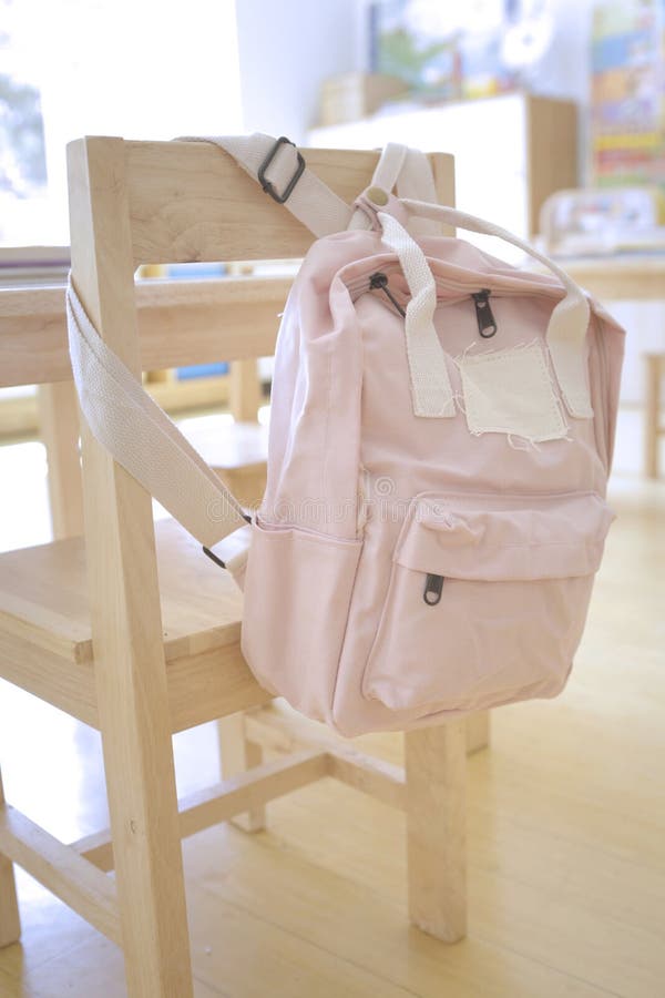 Pink Kid Backpack Hanging on a Chair Stock Image - Image of child ...