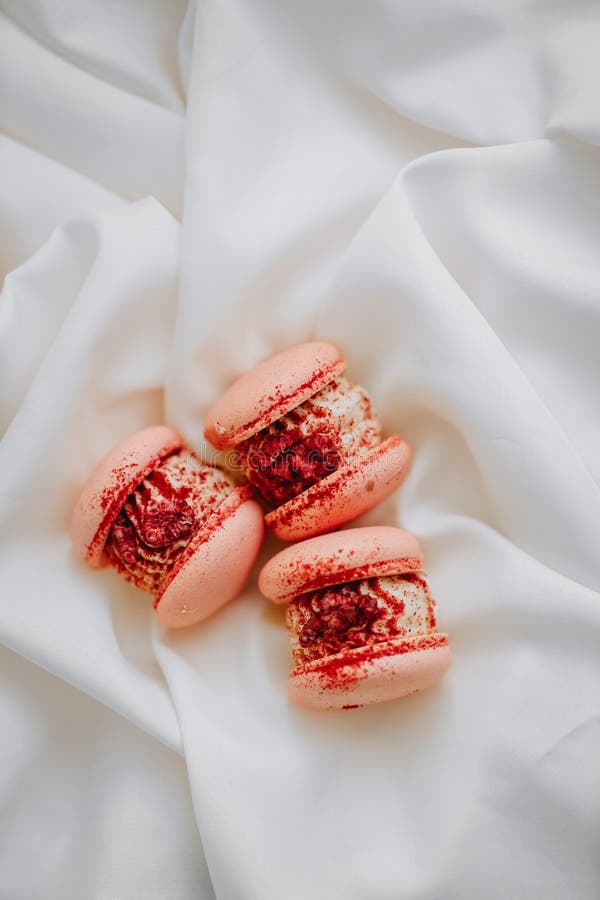 Pink Large Macaroons with Raspberry Filling on a Pretty White Cloth ...
