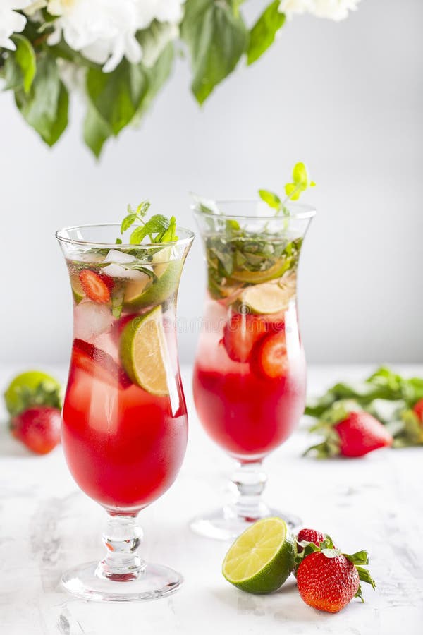Pink Lemonade with Strawberries, Lime, Basil and Mint Stock Photo ...