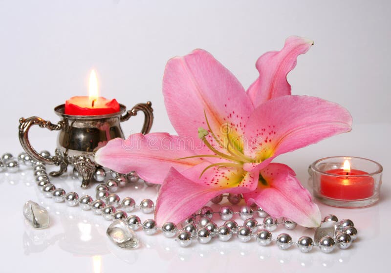 Pink lily and candles stock photo. Image of flowering - 21396604
