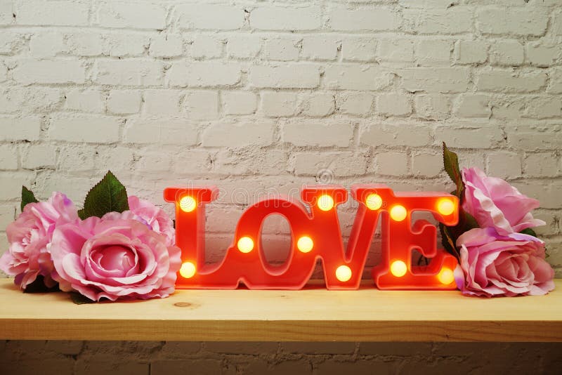 Pink Love LED Decorative on White Brick Wall Background Stock Image ...