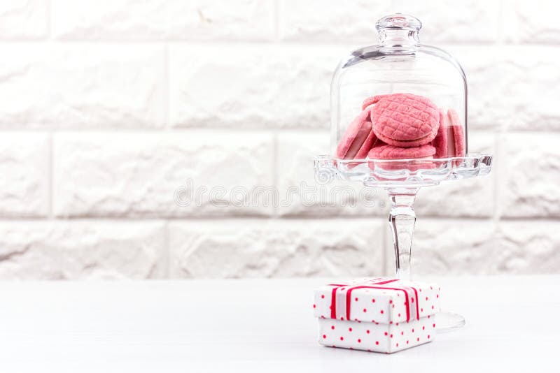 Pink Macaroon Cookies in a Crystal Vase and a Gift Box on White ...