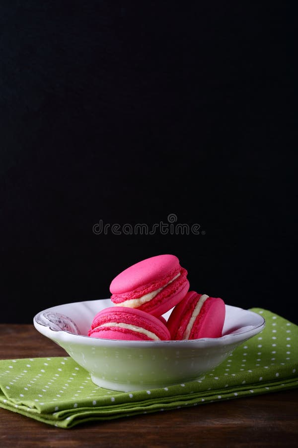 Pink macaroon in a plate stock photo. Image of confectionery - 62204070